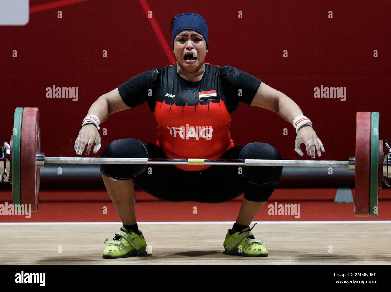 Iraq's Huda Al-Saedi competes in the women's 75kg during the women's ...