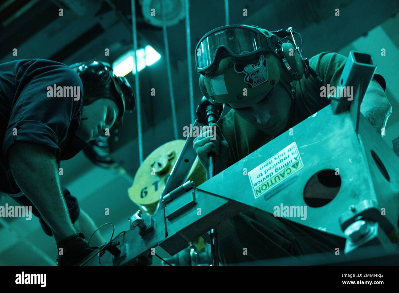 U.S. Marine Corps Cpl. Joseph Diiacovo, left, an F-35B power line ...