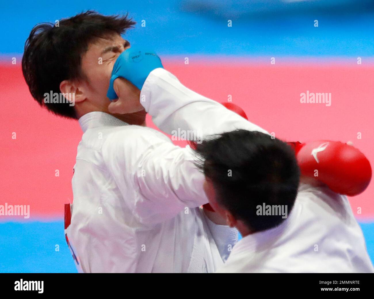 Indonesia's Rifki Ardiansyah, right , competes against Thailand's ...