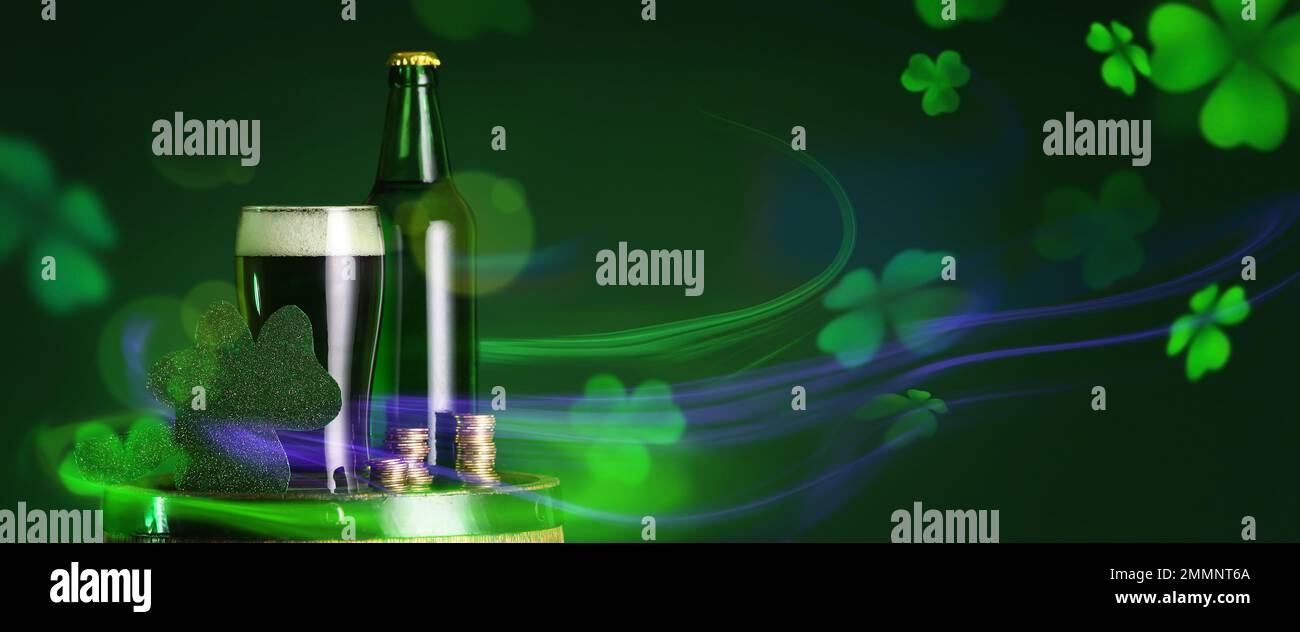 Green beer, coins and barrel on dark background. St. Patrick's Day ...