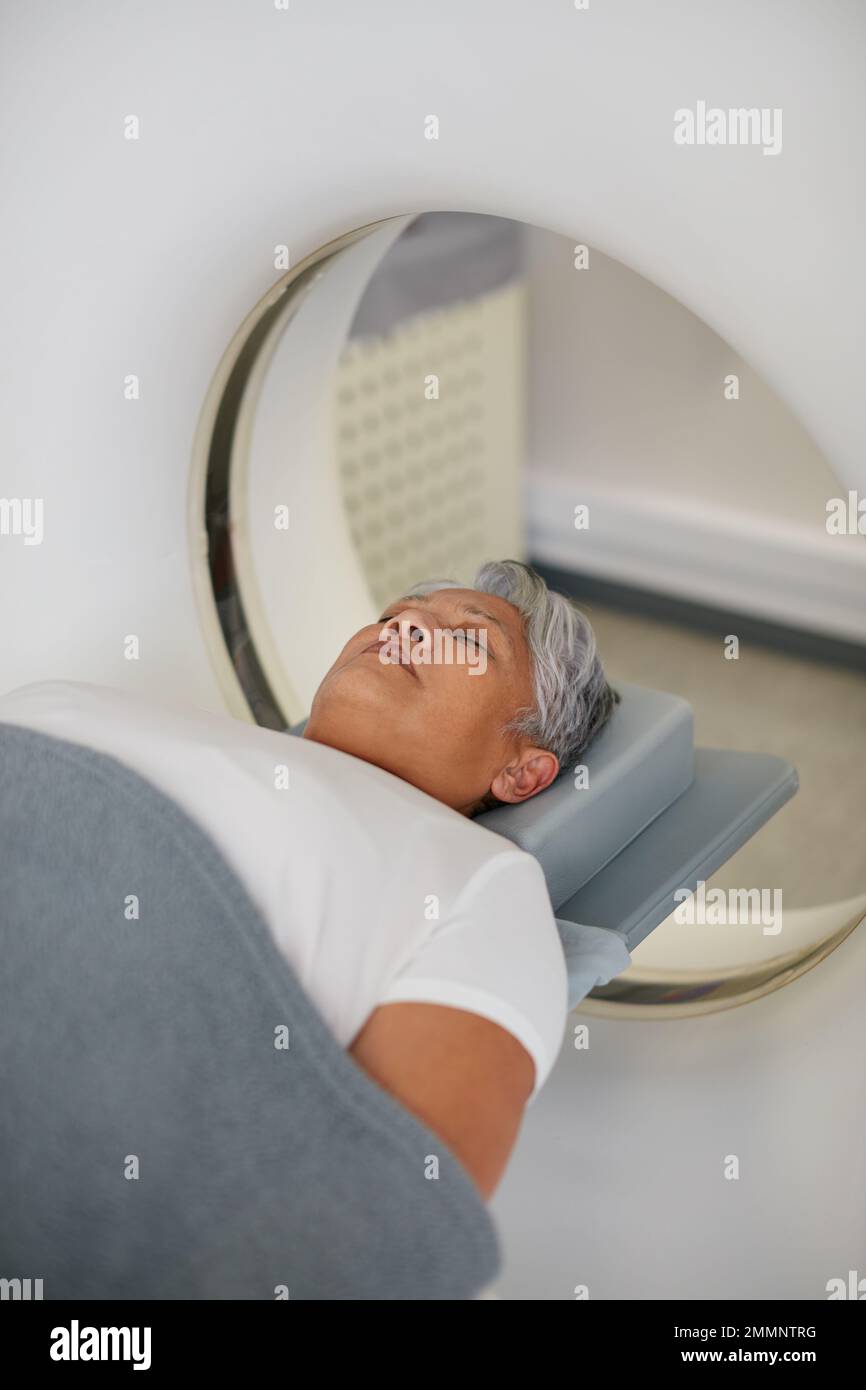 Staying healthy through technology. a senior woman about to have an MRI ...