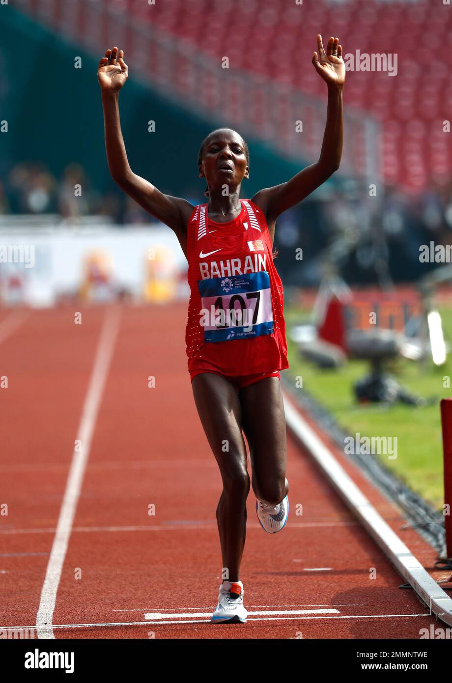 Bahrain's Rose Chelimo crosses the finish line to win the women's ...