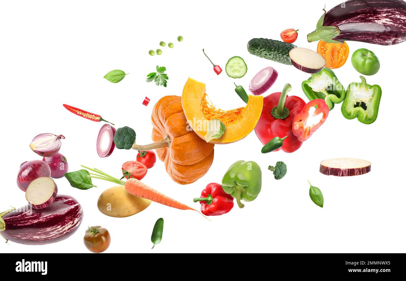 Flying fresh vegetables on white background Stock Photo - Alamy