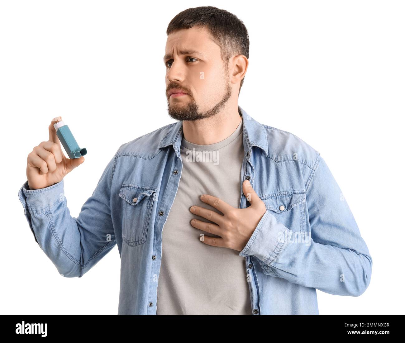 Sick man with inhaler on white background Stock Photo - Alamy