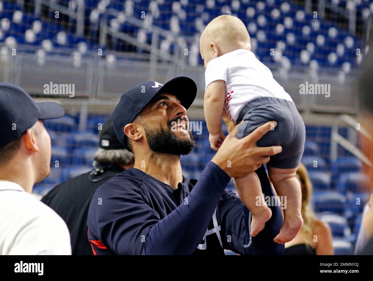 Atlanta Braves right fielder Nick Markakis holds his nephew, Ethan ...