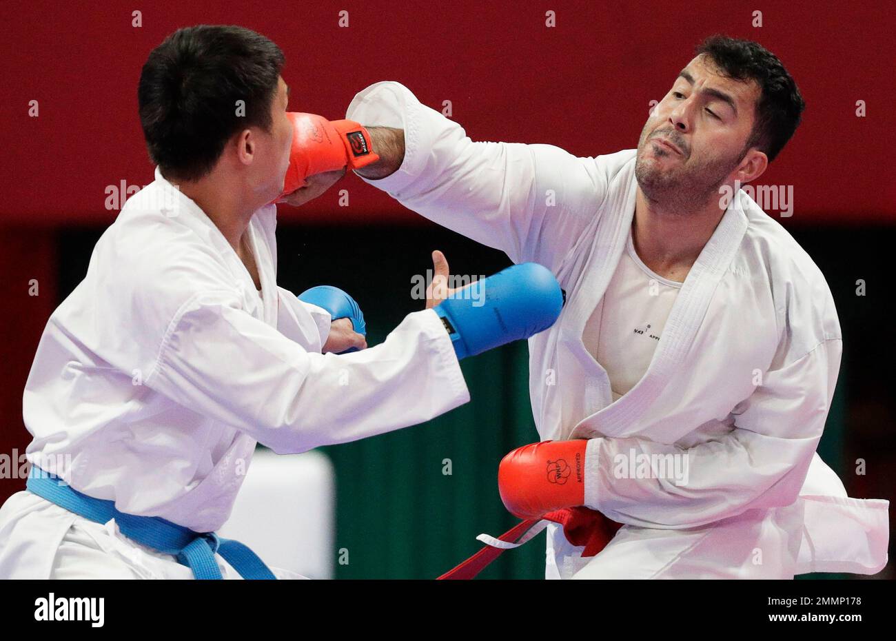 Iran's Sajad Ganjzadeh, right, punches Vietnam's Minh Phung Nguyen to ...