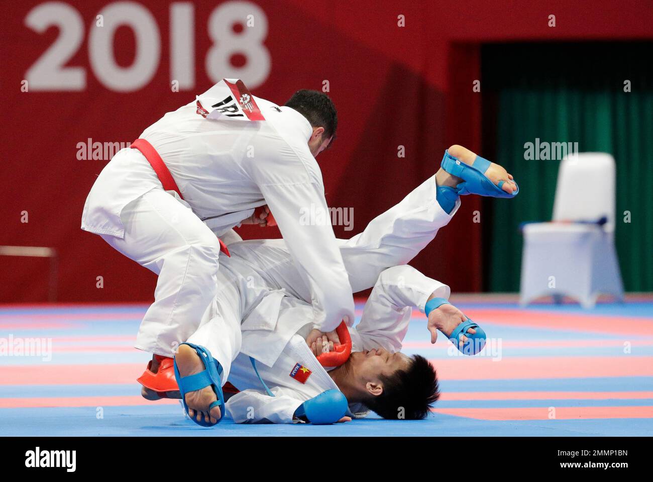 Iran's Sajad Ganjzadeh, left, punches Vietnam's Minh Phung Nguyen to ...