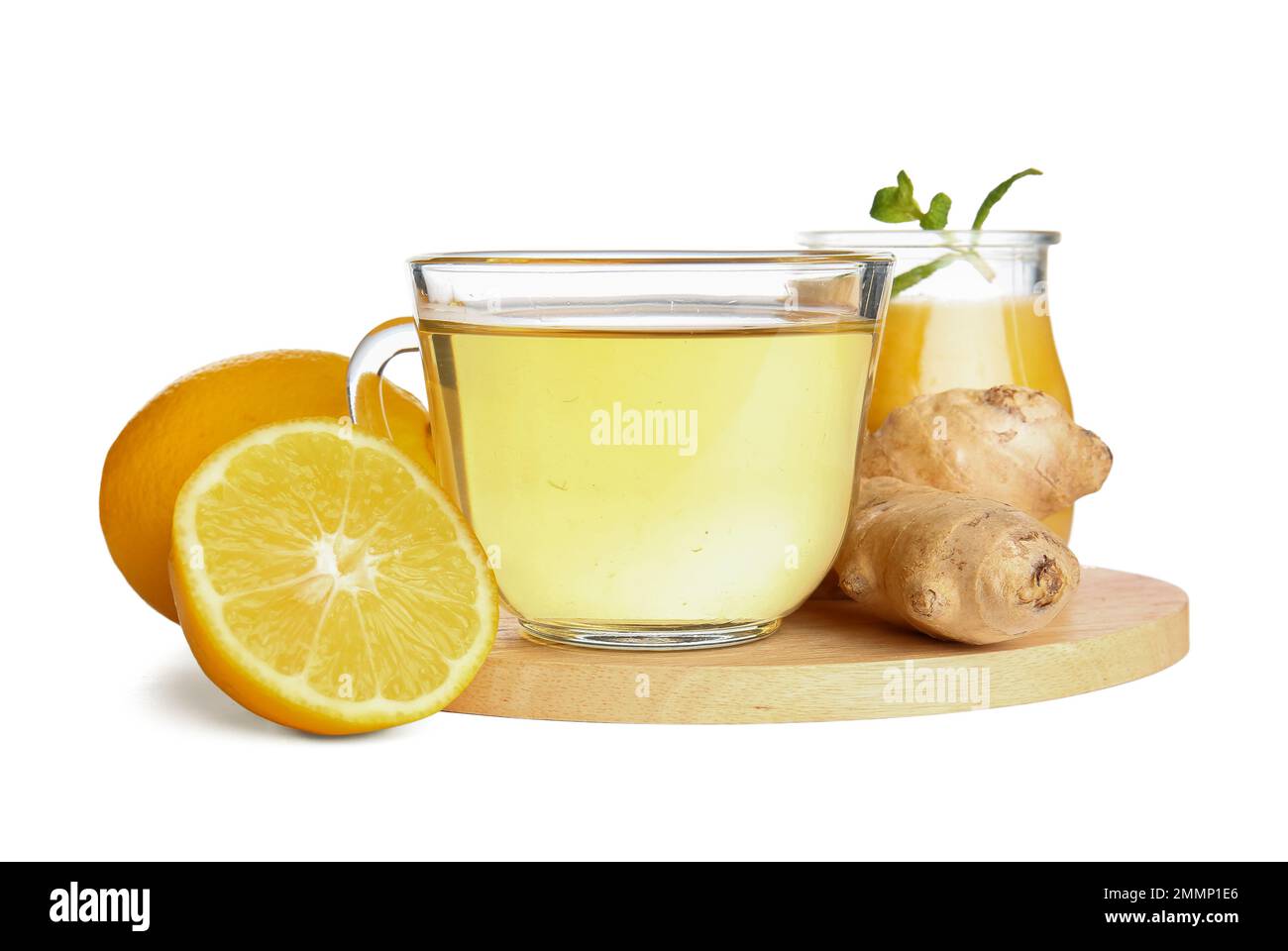 Board with ginger roots, lemon, mint, honey and cup of tea isolated on ...