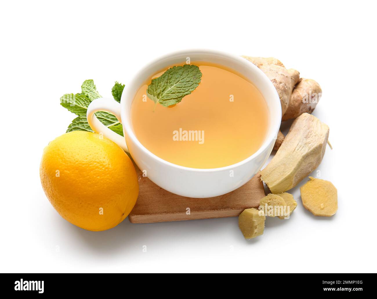 Board with cup of ginger tea, roots and lemon on white background Stock ...