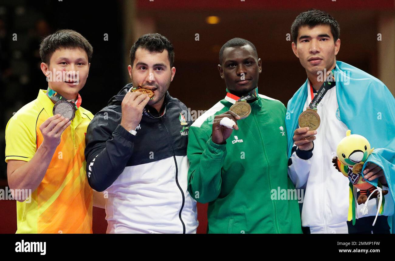 From left, silver medalist Vietnam's Minh Phung Nguyen, gold medalist ...