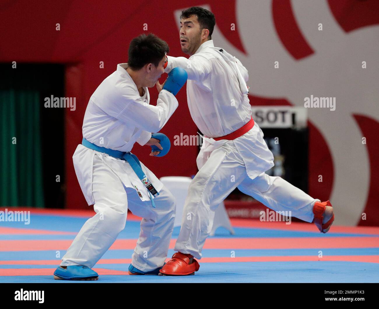 Iran's Sajad Ganjzadeh, right, punches Vietnam's Minh Phung Nguyen to ...