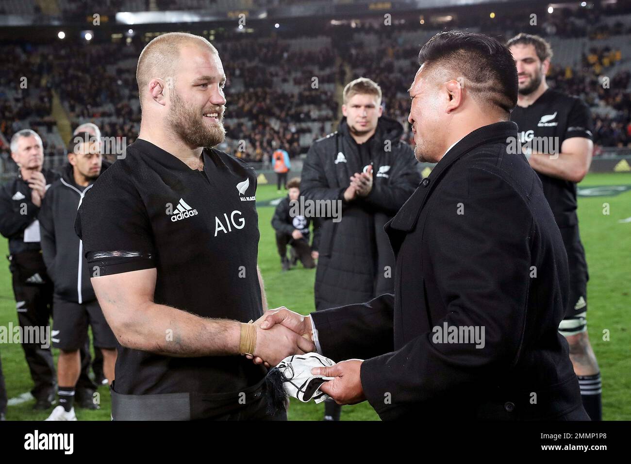 New Zealand's Owen Franks, left, receives his 100th international ...