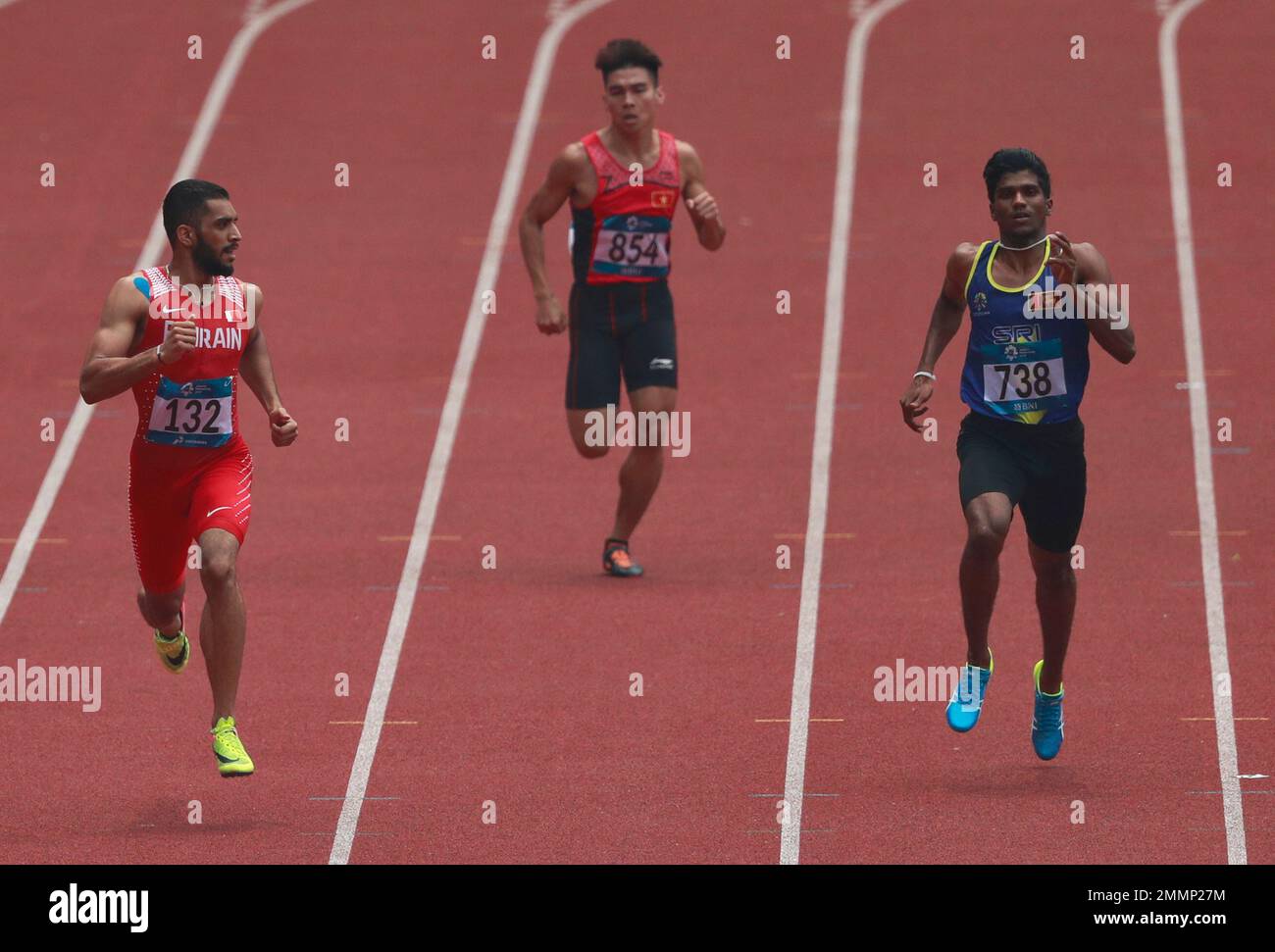 Bahrain's Ali Khamis, left, looks across to Sri Lanka's Aruna ...