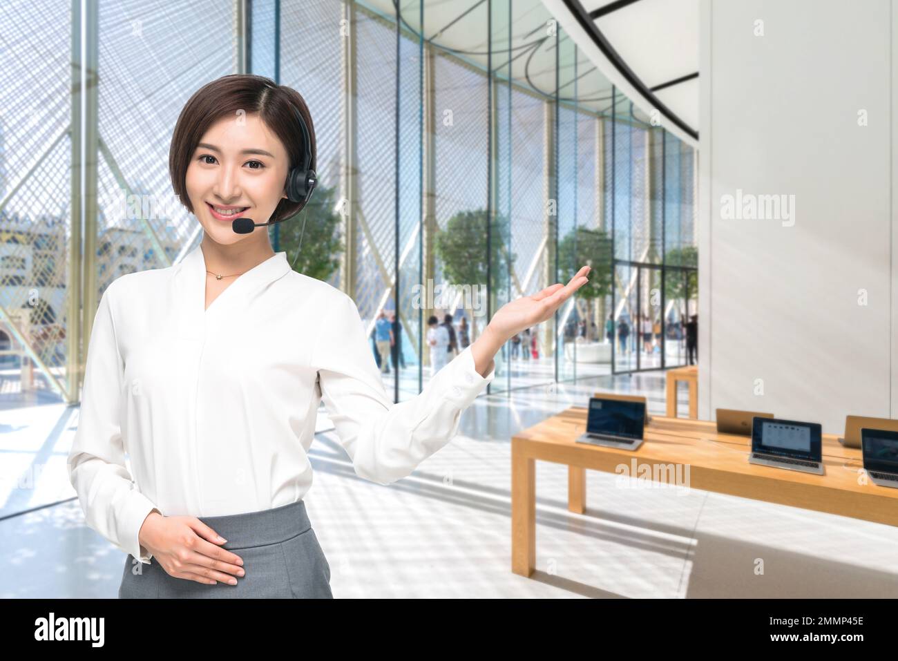The female customer service staff wearing headphones Stock Photo - Alamy
