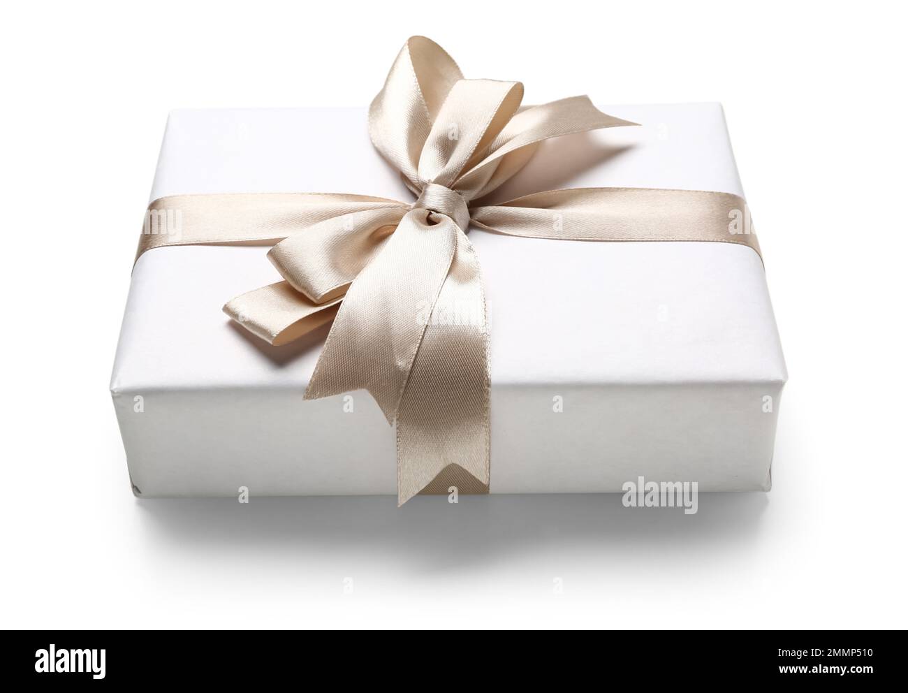 Gift box tied with shiny satin ribbon on white background Stock Photo ...