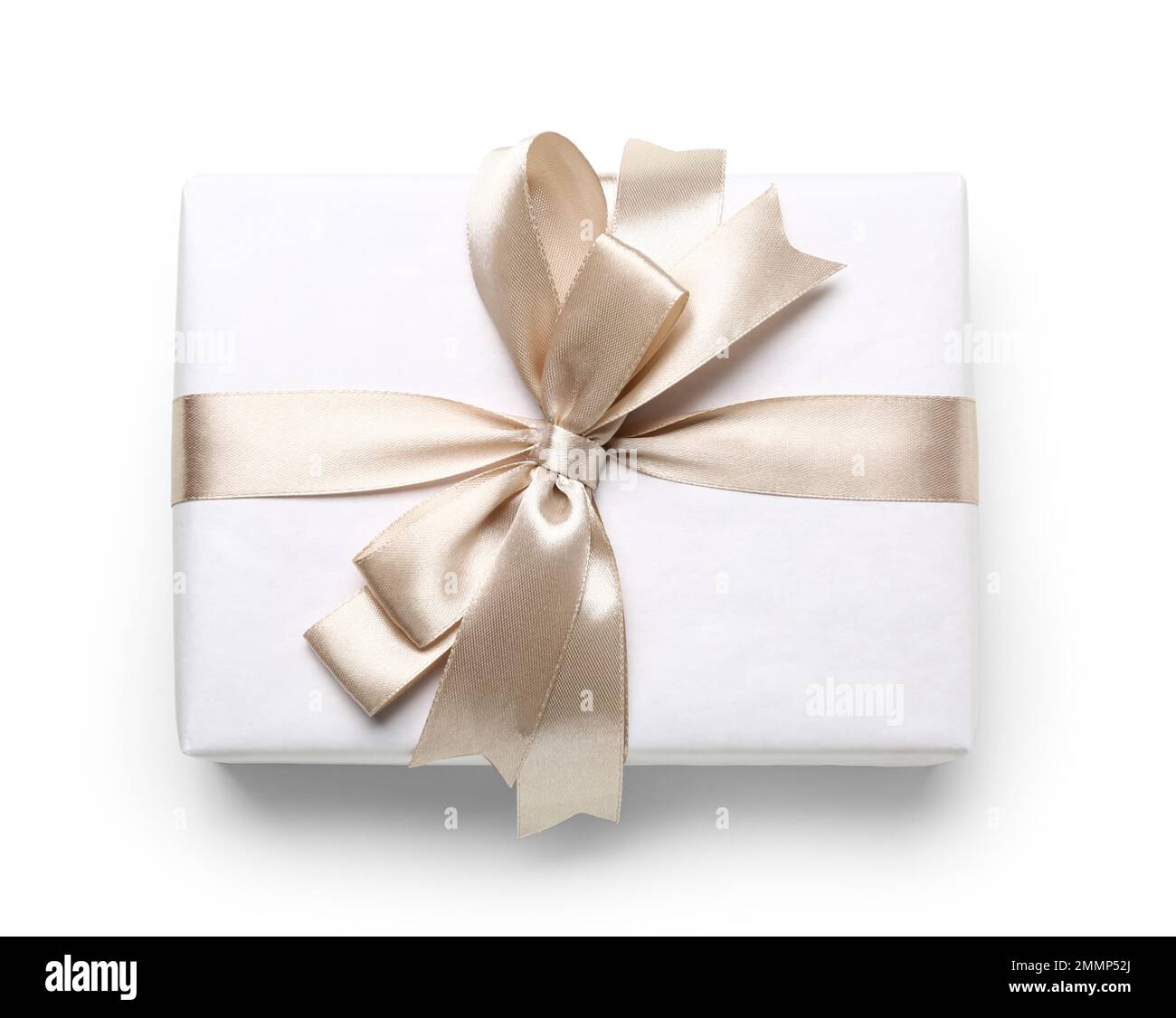 Gift box tied with shiny satin ribbon on white background Stock Photo ...