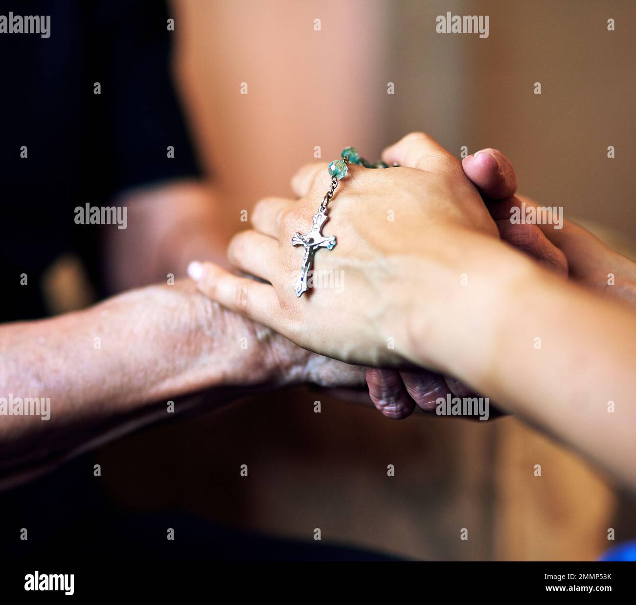 Together in prayer. a senior woman being comforted by her nurse while ...