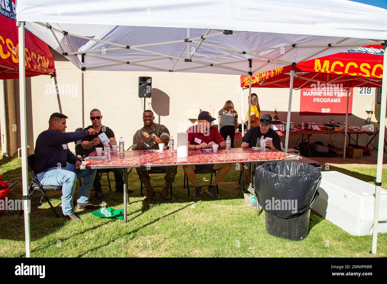 Judges critique the various chili entries in the chili cook-off event ...