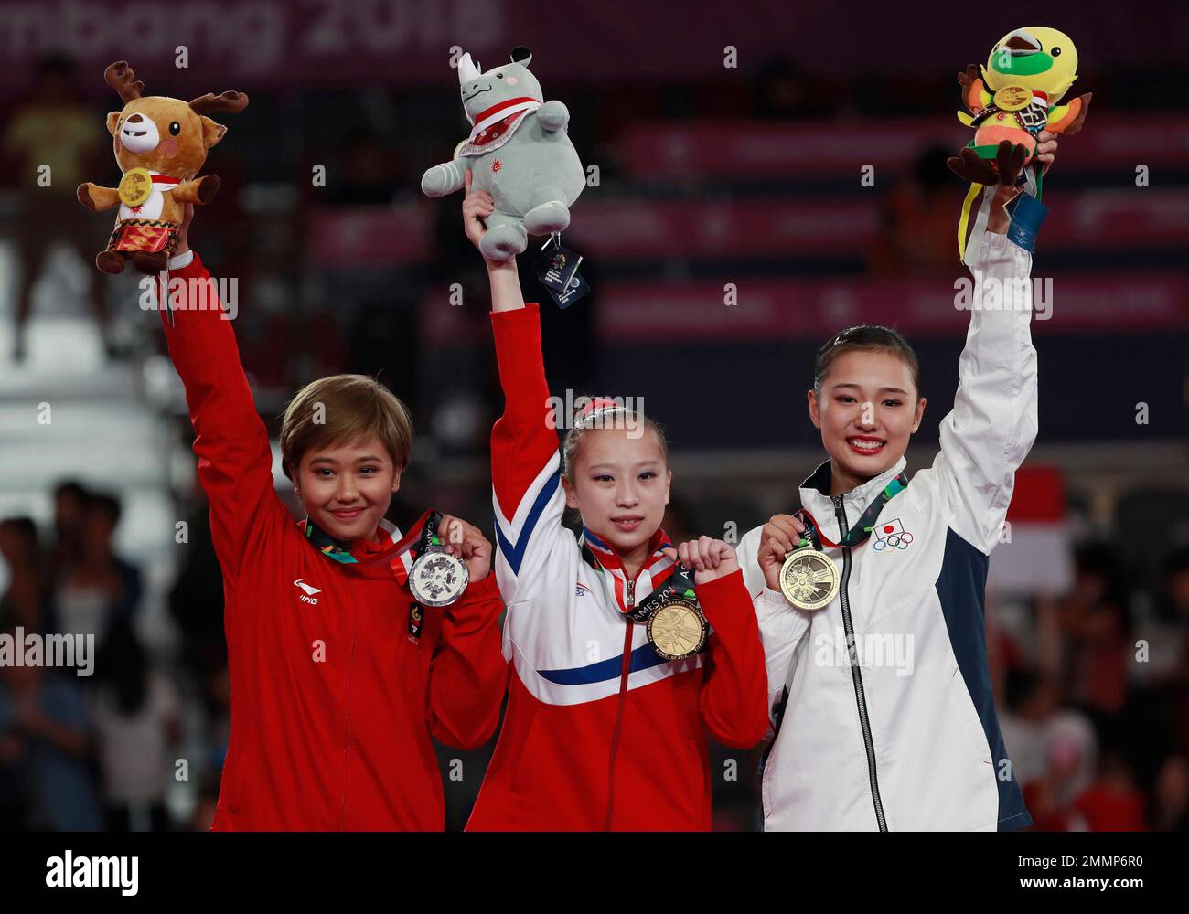 From left to right, silver medalist Rifda Irfanaluthfi of Indonesia ...