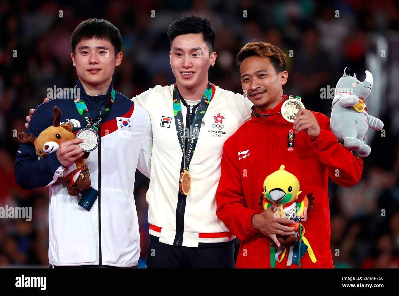 Men's vault gold medalist Hong Kong's Shek Wai Hung, centre, stands ...