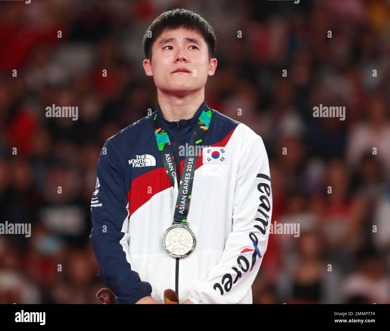 South Korea's Kim Han-sol stands on the podium after receiving his ...