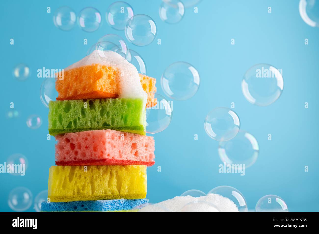Household Cleaning Scrub Colored Sponges with soap foam and bubbles ...