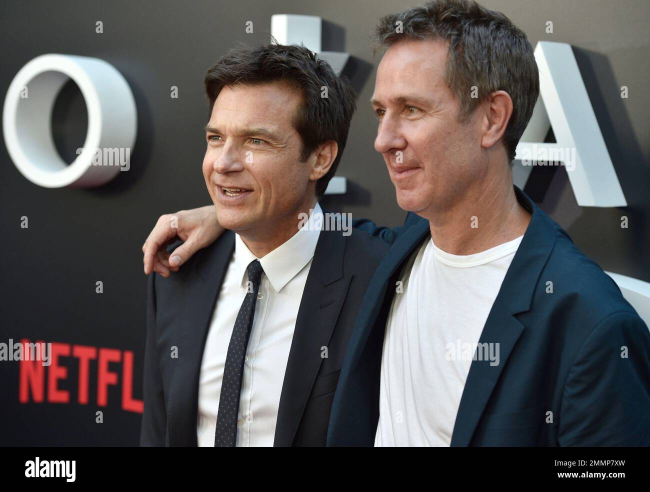 Showrunner/executive producer Chris Mundy, right, and Jason Bateman ...