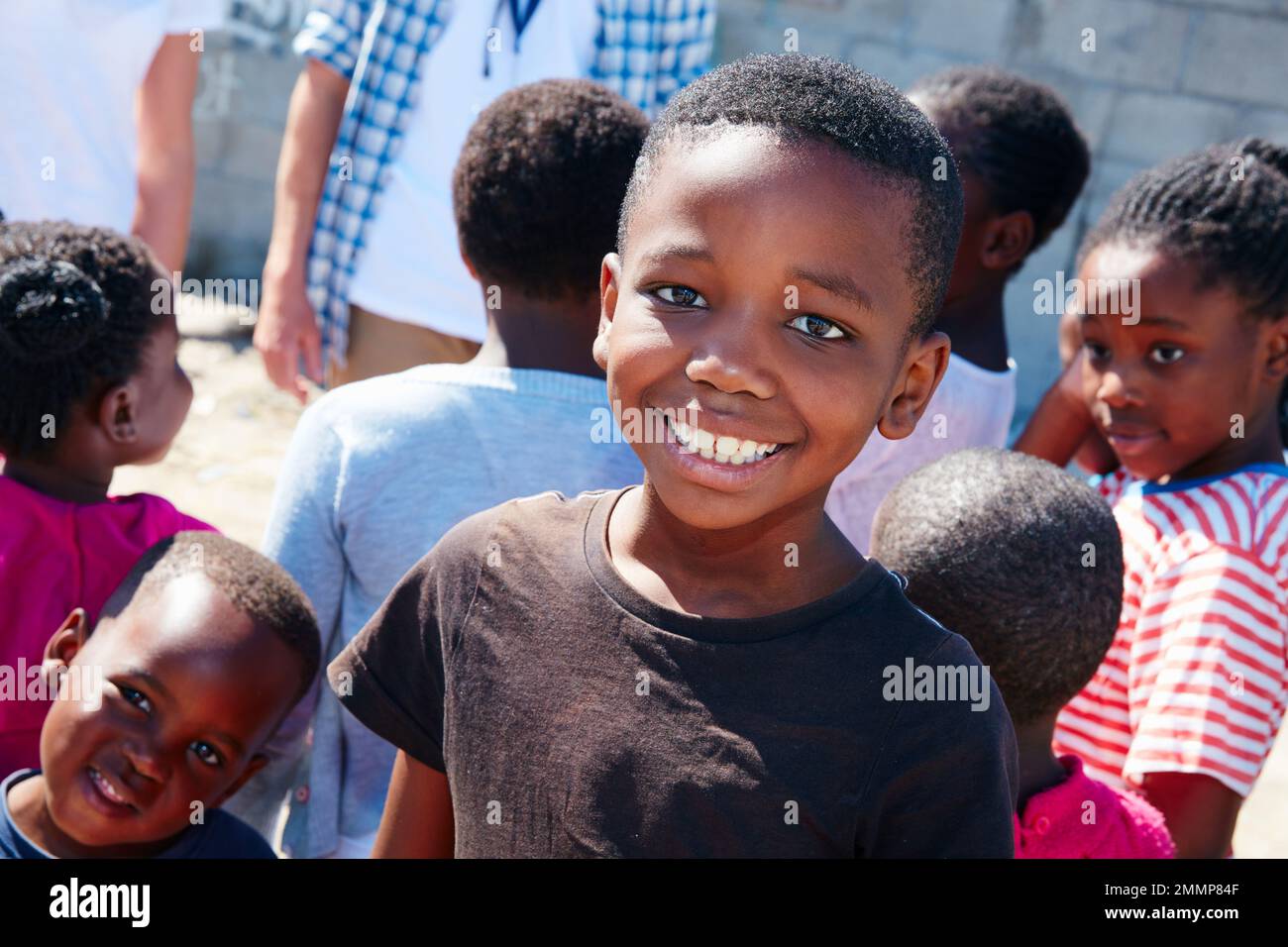 He enjoys these outreach events. Cropped portrait of a young child at a ...