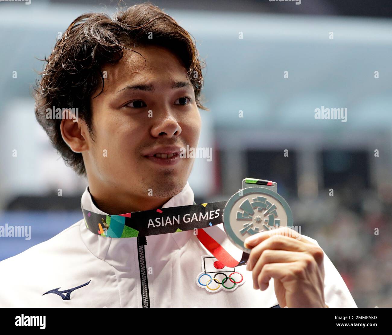 Japan's Katsumi Nakamura shows his silver medal following the men's ...