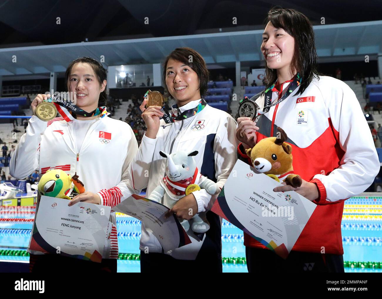 Women's 50m breaststroke gold medalist Japan's Satomi Suzuki, centre ...
