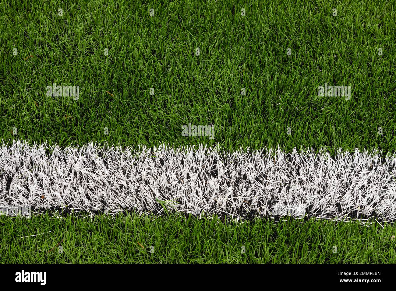 Photo of a green synthetic grass sports field with white line shot from ...