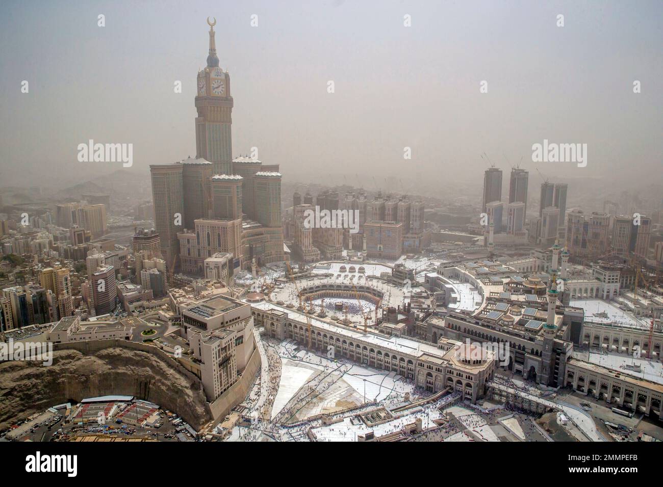 An aerial view shows the Grand Mosque as Muslim pilgrims walk around ...