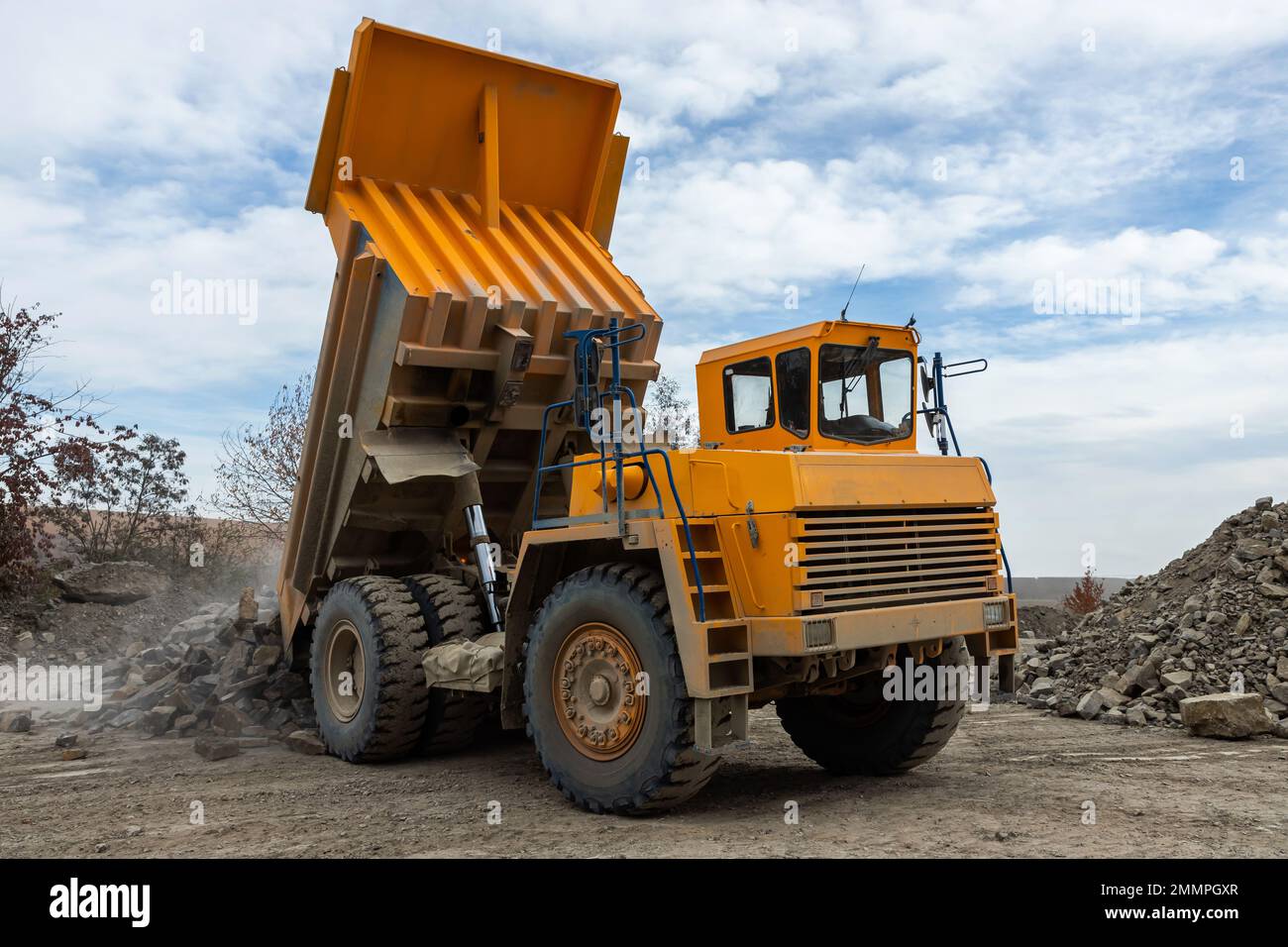 Large mining dump truck. Transport industry. Extraction of stone in an ...