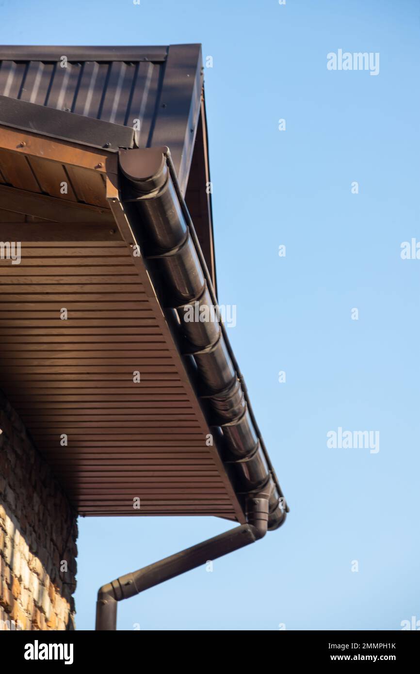 Building Modern House Construction with metal roof corner, rain gutter ...