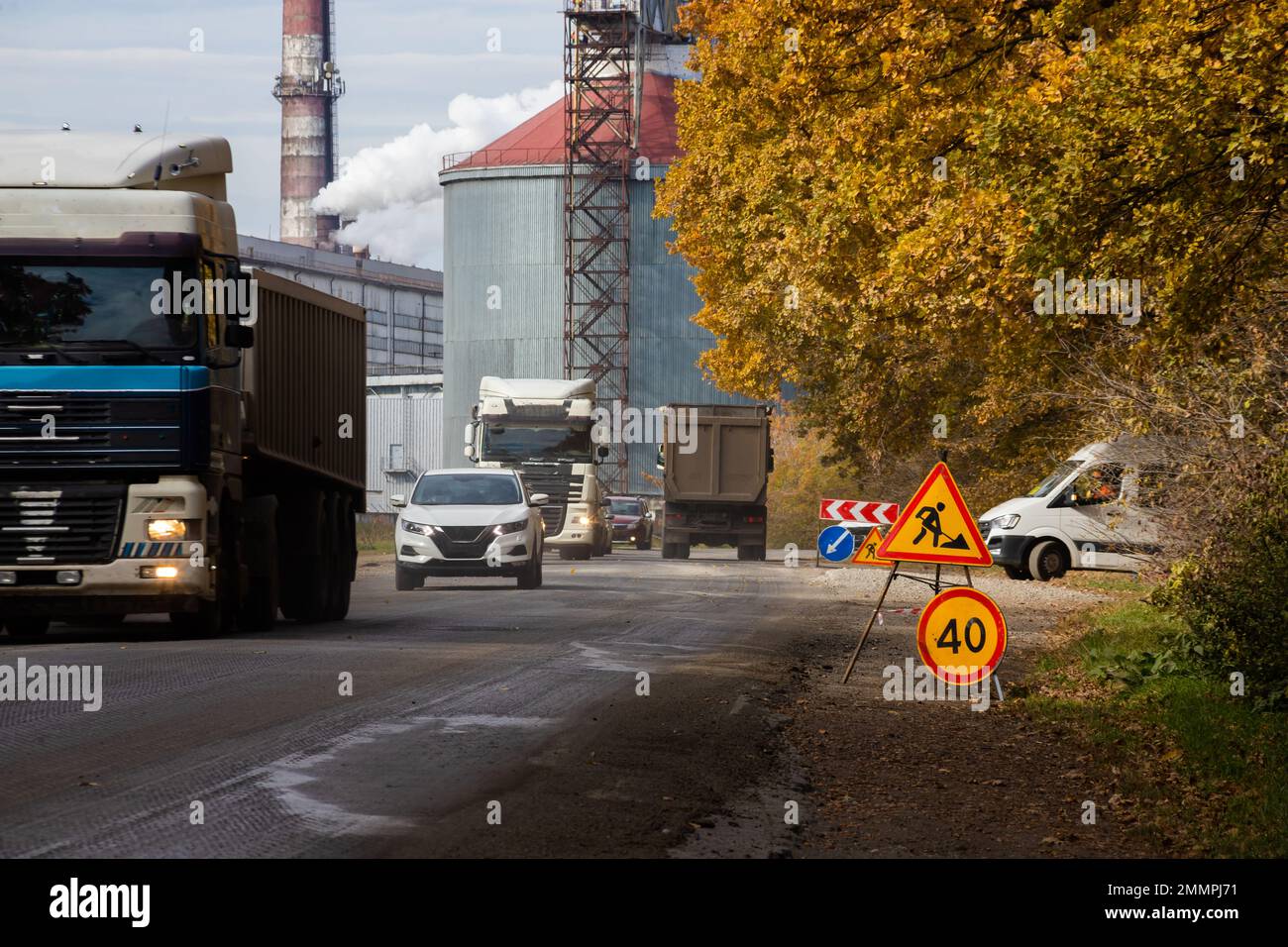 Roadworks warning sign ahead on street sidewalk. Close-up Stock Photo - Alamy