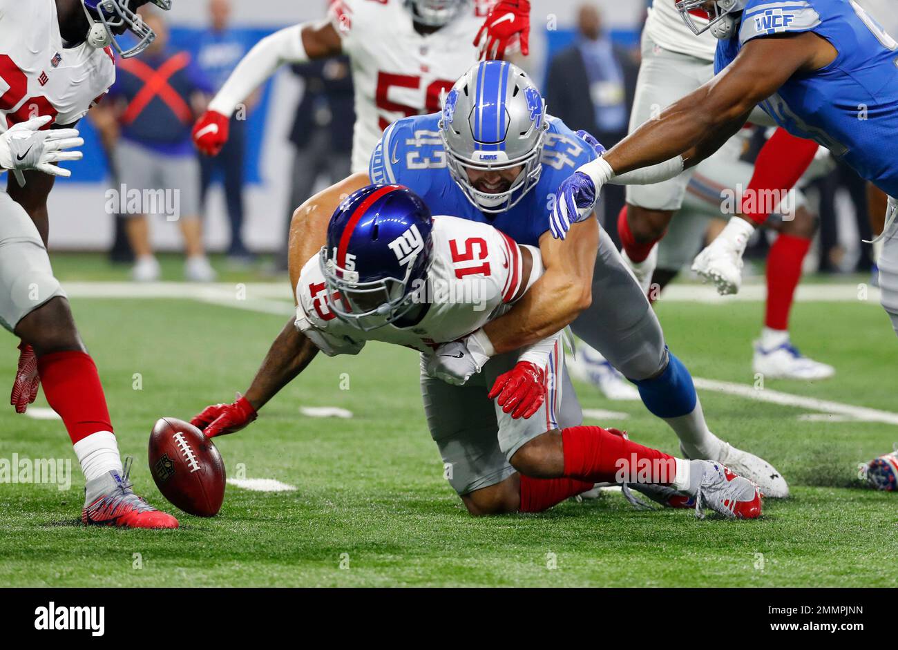 Detroit Lions' Nick Bellore (43) causes New York Giants wide receiver ...