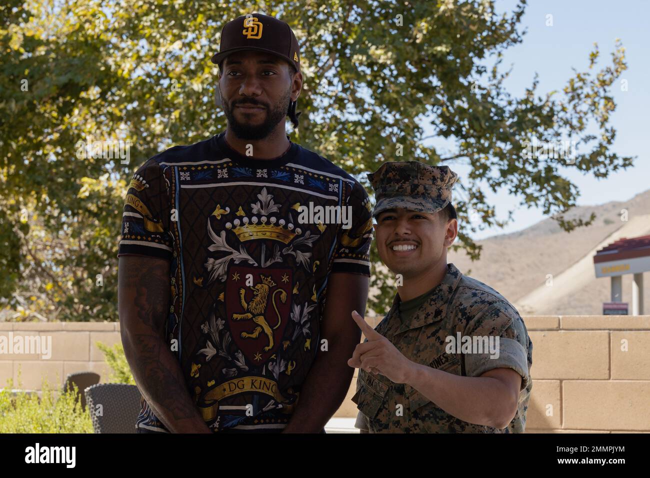 U.S. Marine Corps Cpl. Carlos Pina, right, a radio operator with Headquarters and Service ...