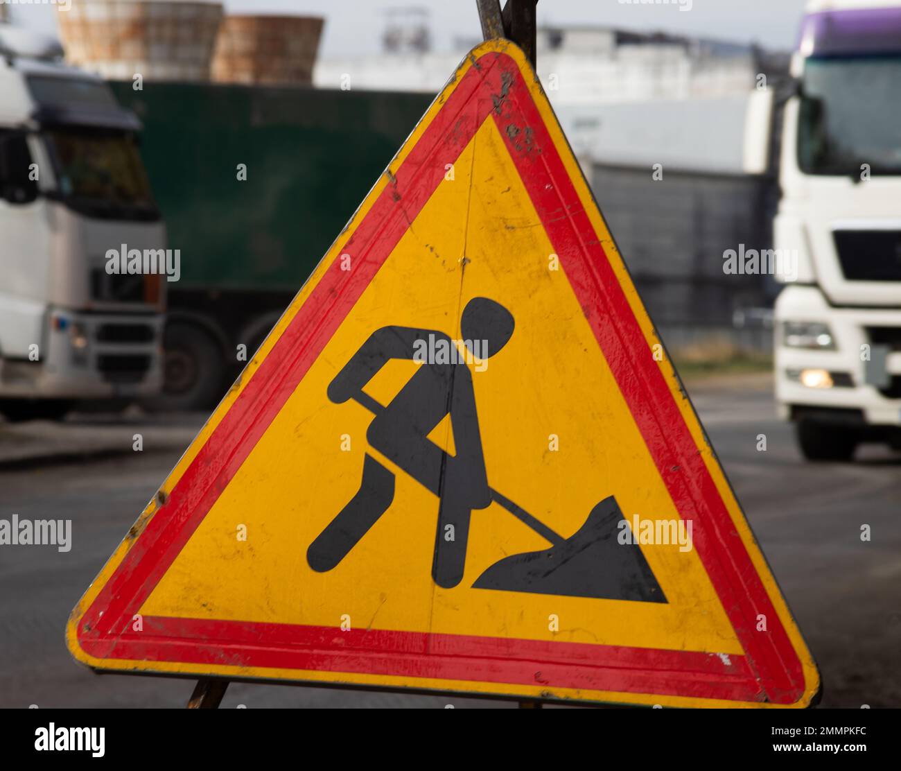 Roadworks warning sign ahead on street sidewalk. Close-up Stock Photo - Alamy