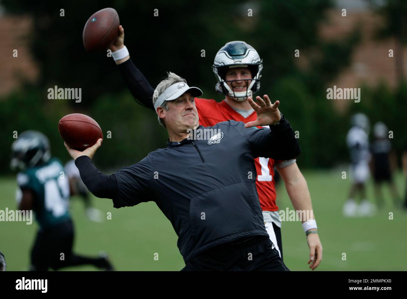 Philadelphia Eagles' head coach Doug Pederson throws a pass as ...