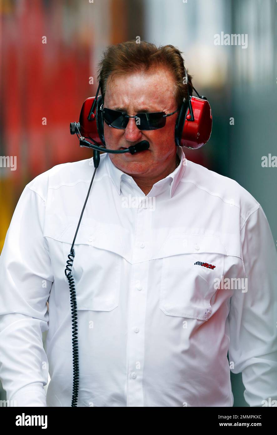 Team owner Richard Childress walks between car hauler's during practice ...