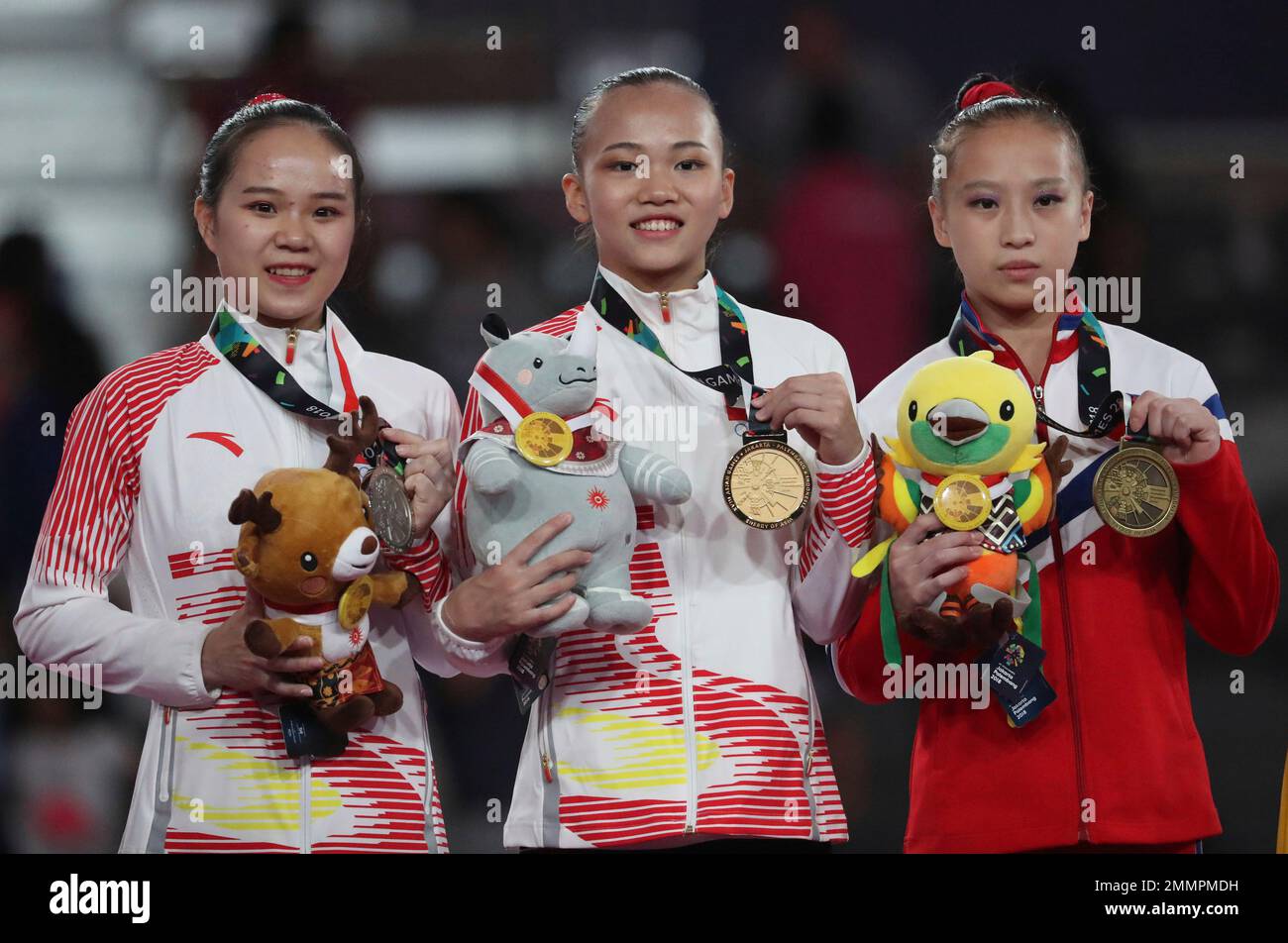 From left to right, silver medalist Luo Huan, gold medalist Chen Yile ...