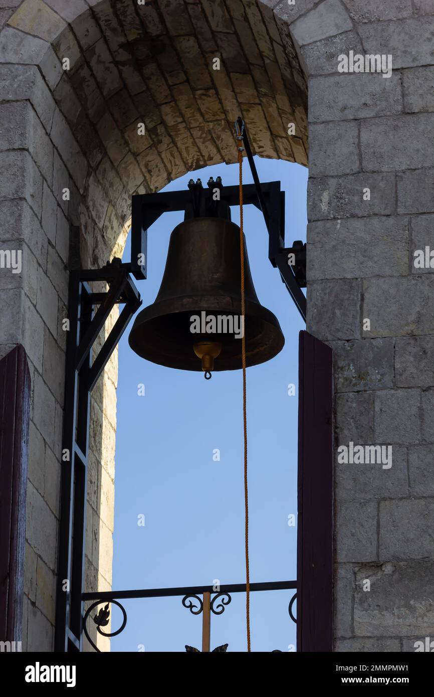 Large Church bell hanging outside. Close-up view of metal orthodox ...