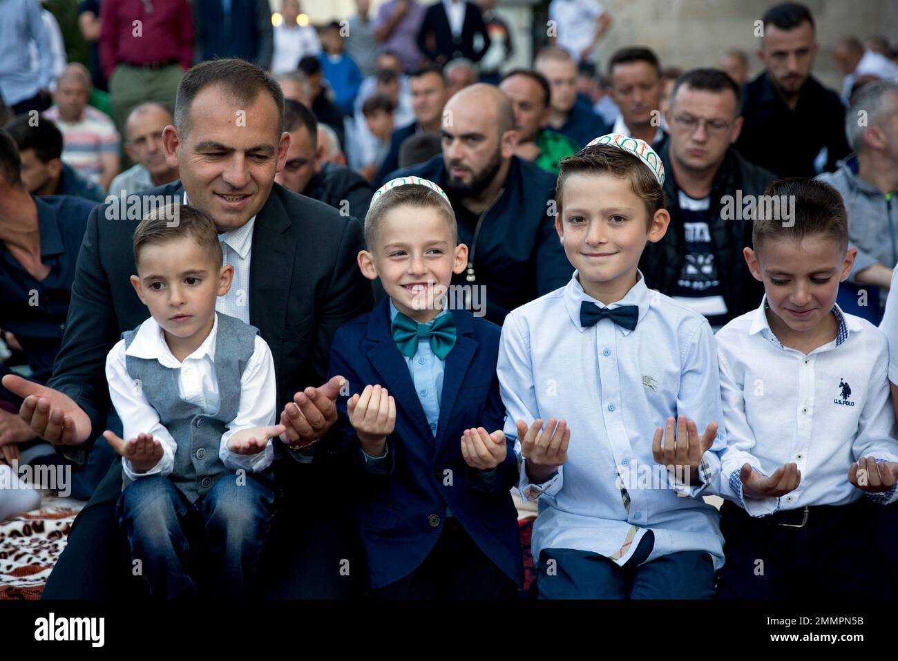 Men and boys pray to mark the first day of Eid al-Adha outside the Sultan Mehmet Fatih mosque in ...