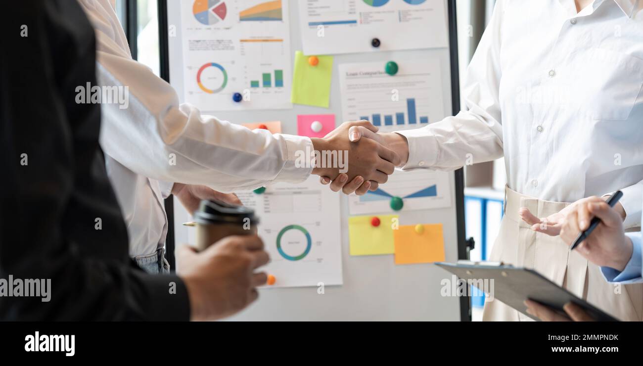 Business handshake for teamwork of business merger and acquisition ...