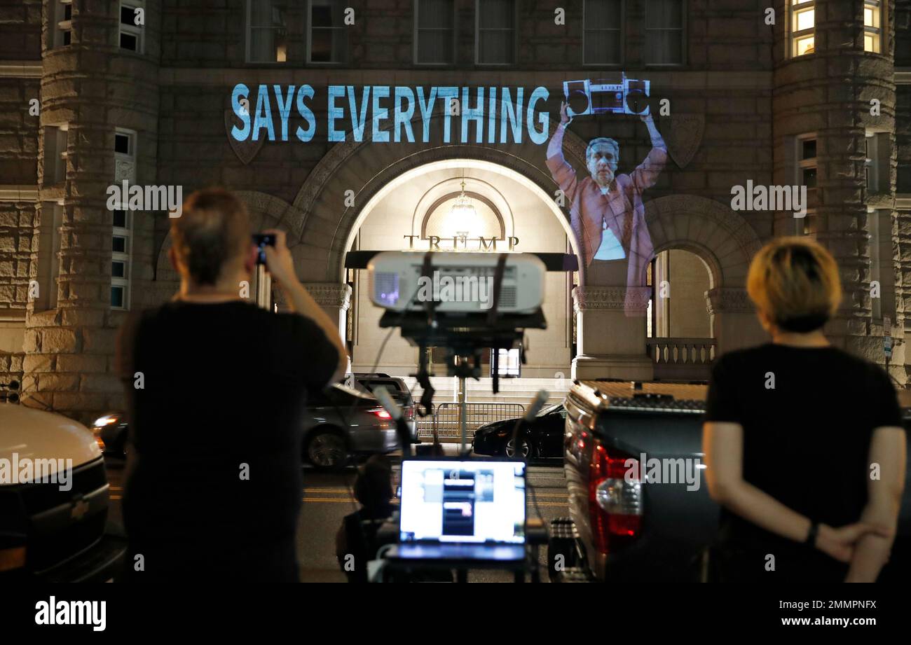 Robin Bell, left, and Sorane Yamahira look at their work projected on ...