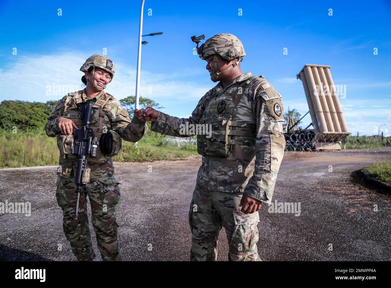 U.S. Army Spc. Keo Taianao, right, fist-bumps Spc. Sirena Sanchez at ...