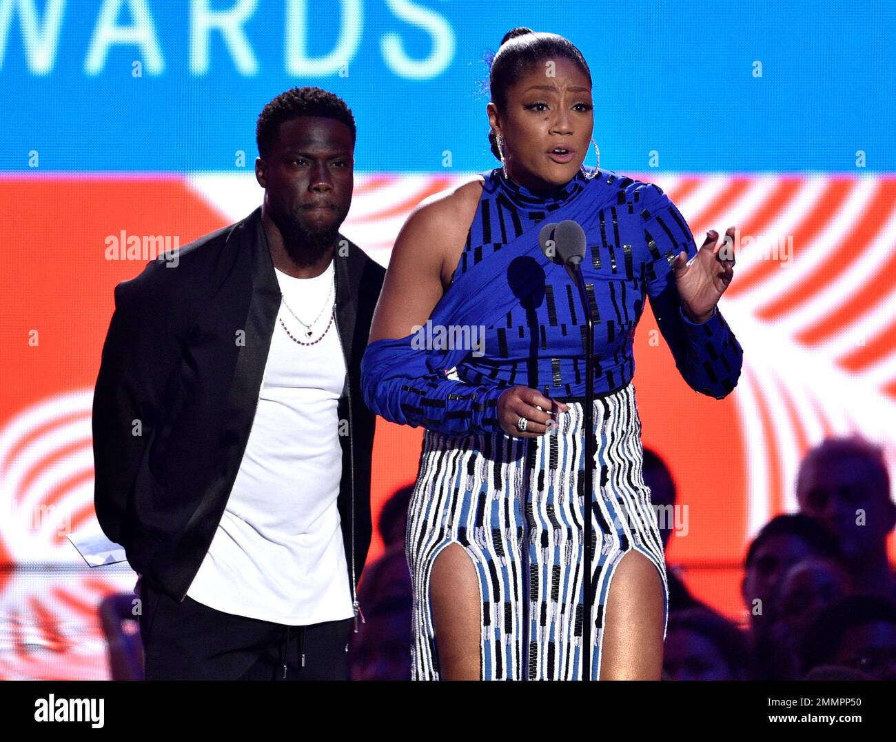 Kevin Hart, left, and Tiffany Haddish present the award for best hip ...