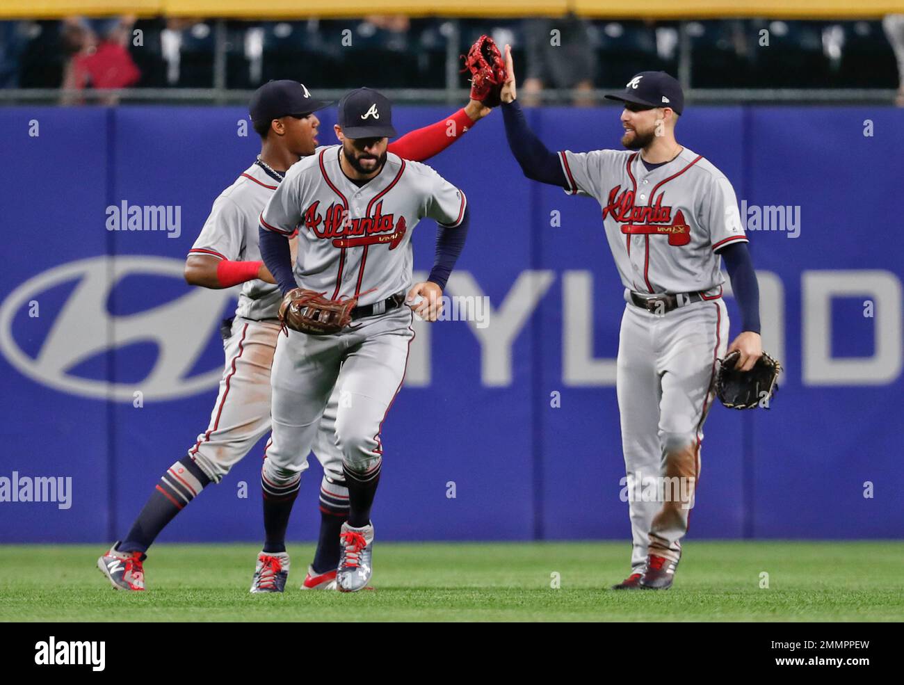 Atlanta Braves right fielder Nick Markakis, right, center fielder Ender ...