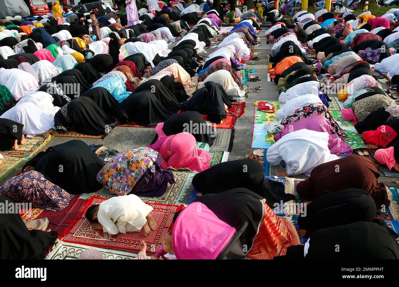 Filipino Muslims pray outside the Blue Mosque in observance of Eid al ...