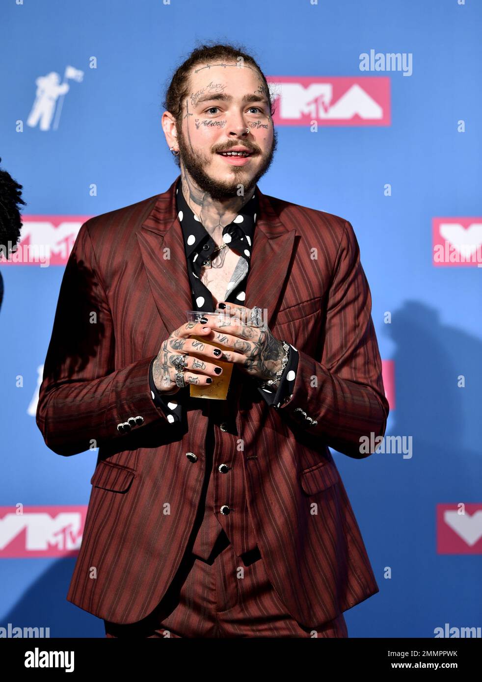 Post Malone poses with the award for song of the year for "Rockstar" in ...